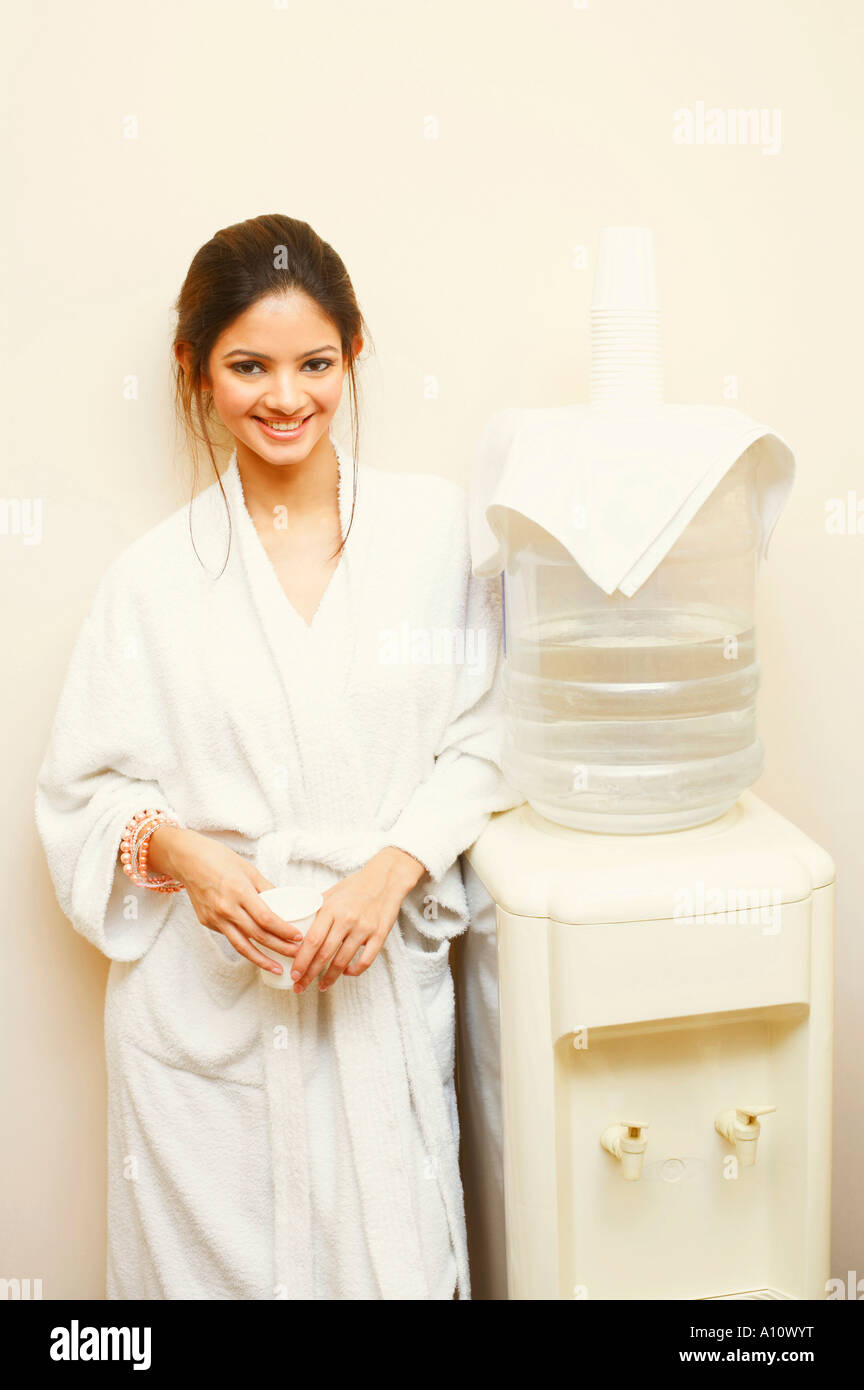 Woman standing water cooler hi-res stock photography and images - Alamy