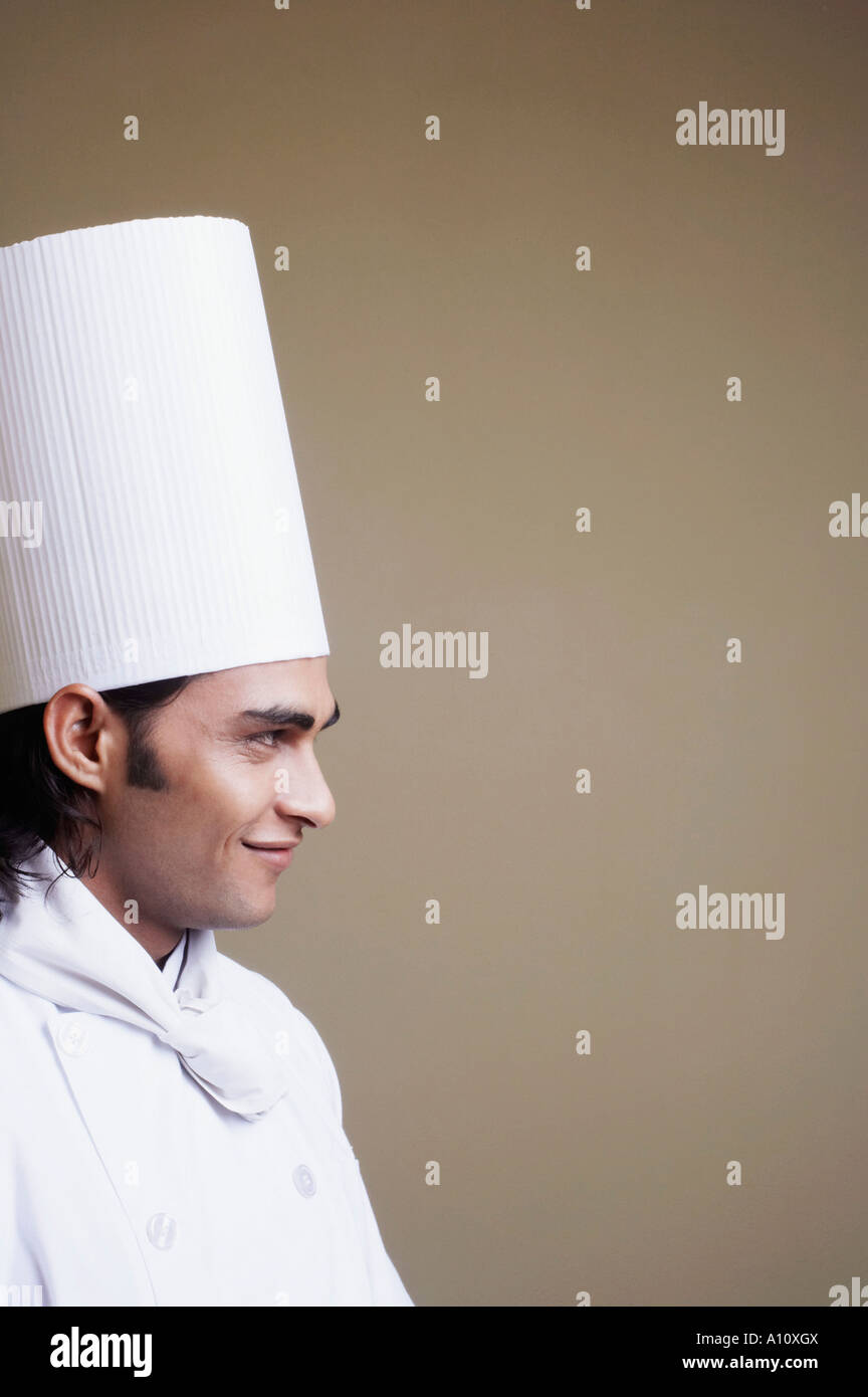 Side profile of a male chef smiling Stock Photo - Alamy