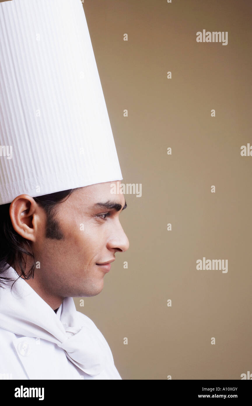 Side profile of a male chef smiling Stock Photo - Alamy