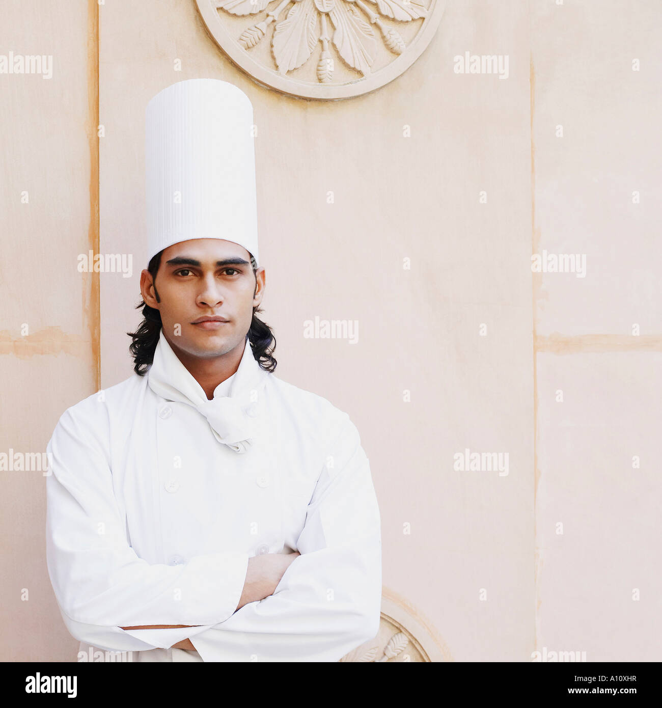 Portrait of a chef standing with his arms crossed Stock Photo - Alamy