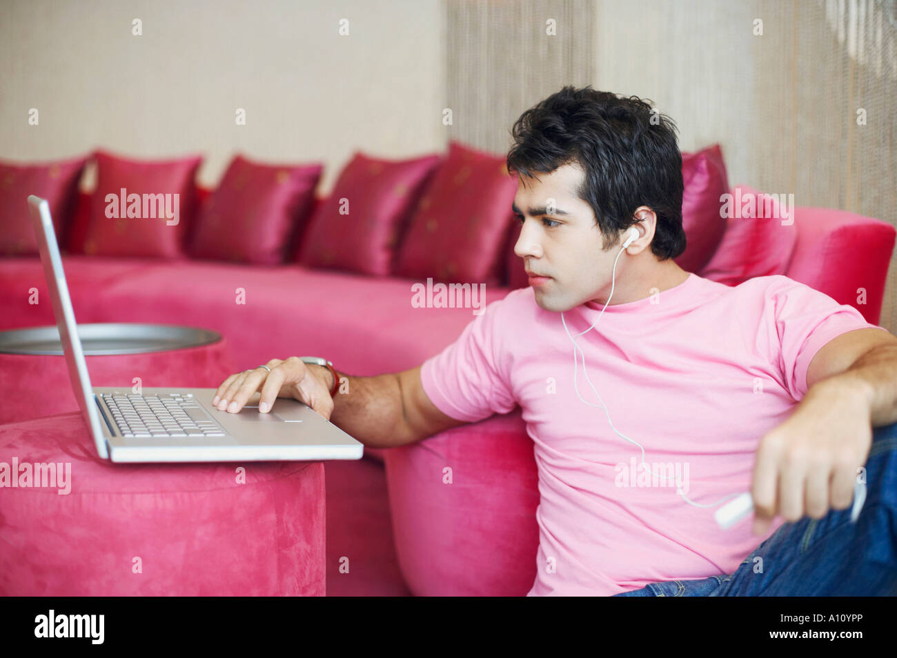Using laptop mp3 player hi-res stock photography and images - Alamy