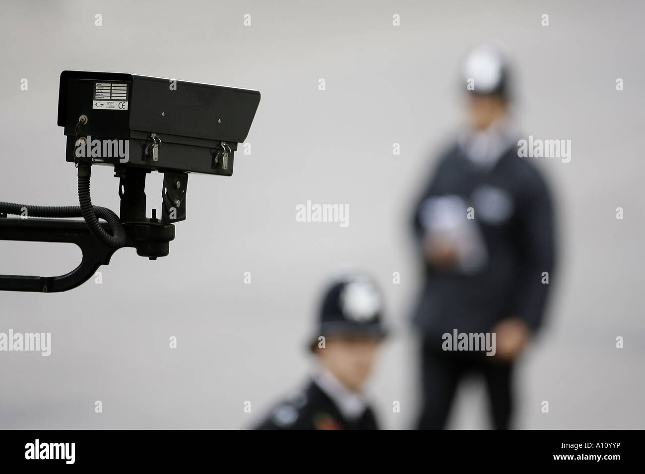 British Policemen are seen in the sights of a CCTV camera in ...