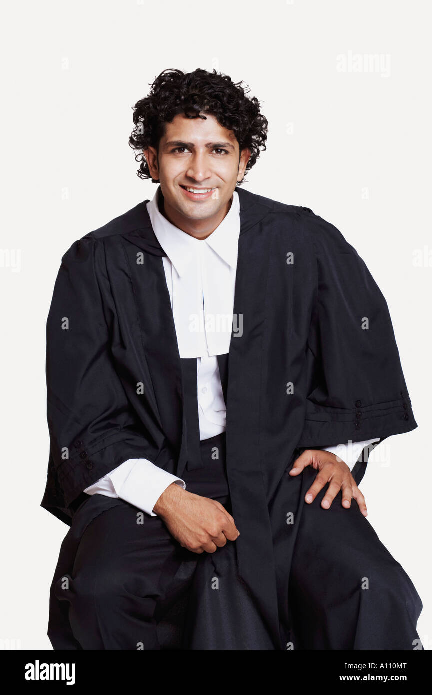 Portrait of a male lawyer sitting and smiling Stock Photo - Alamy