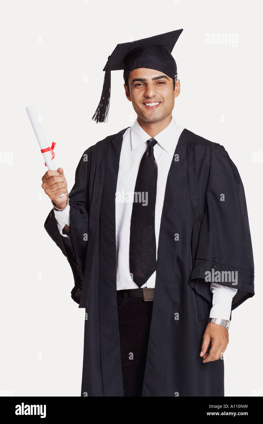 Portrait of a male graduate holding a diploma Stock Photo - Alamy