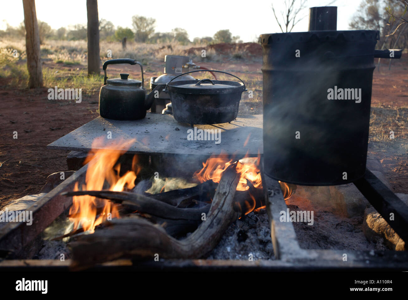 Breakfast cooks over a camp fire in the bush Anangu Pitjantjara lands ...