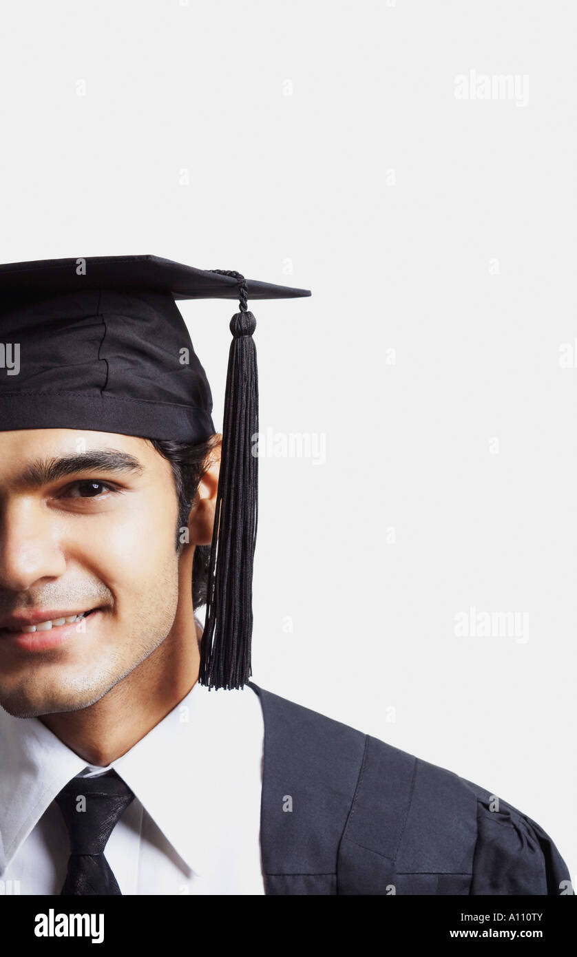 Portrait of a male graduate smiling Stock Photo - Alamy