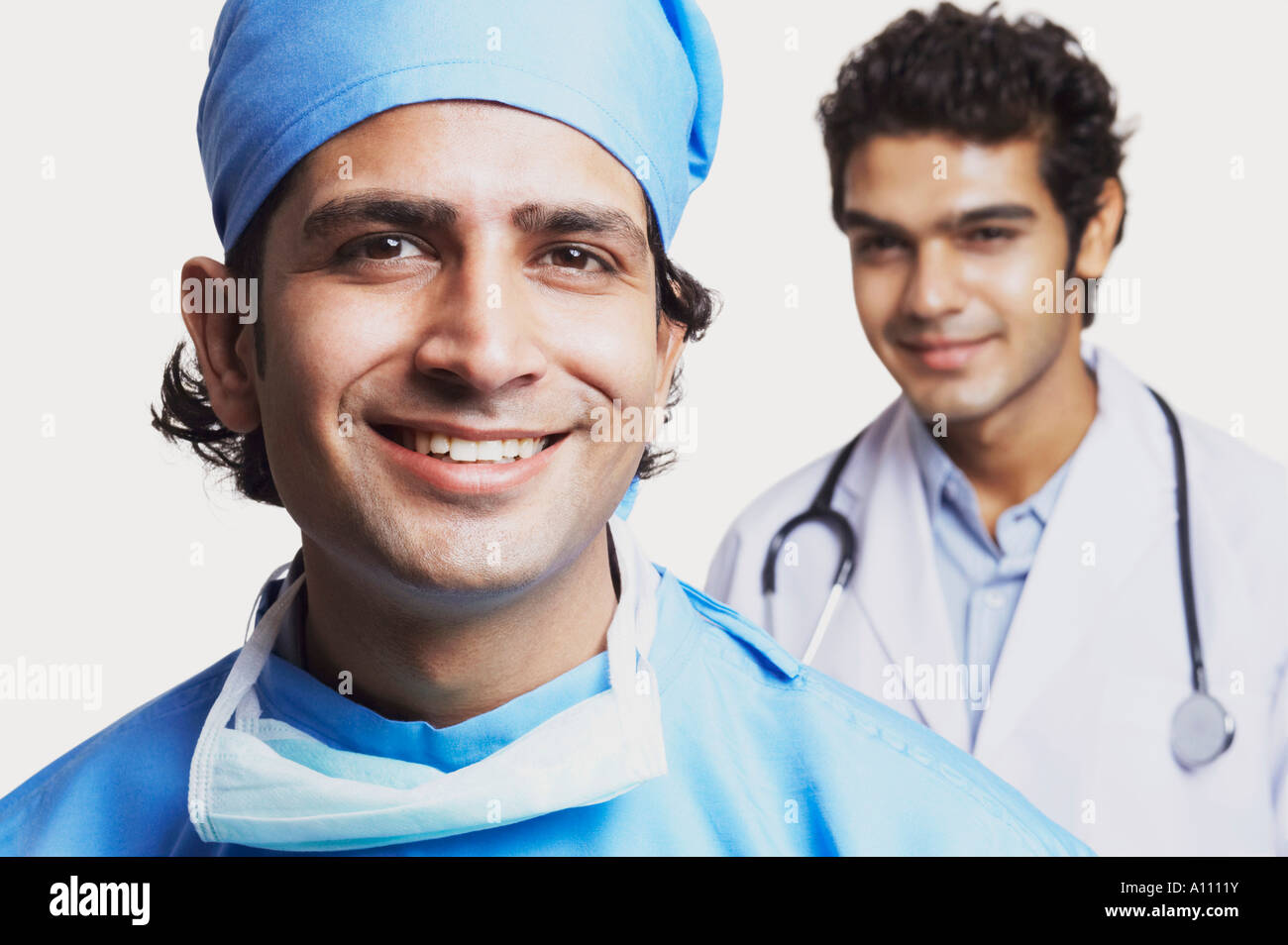 Portrait of two male doctors smiling Stock Photo - Alamy