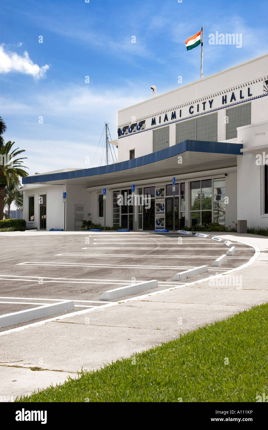 The flag of the City of Miami flies above the Art Deco building of ...