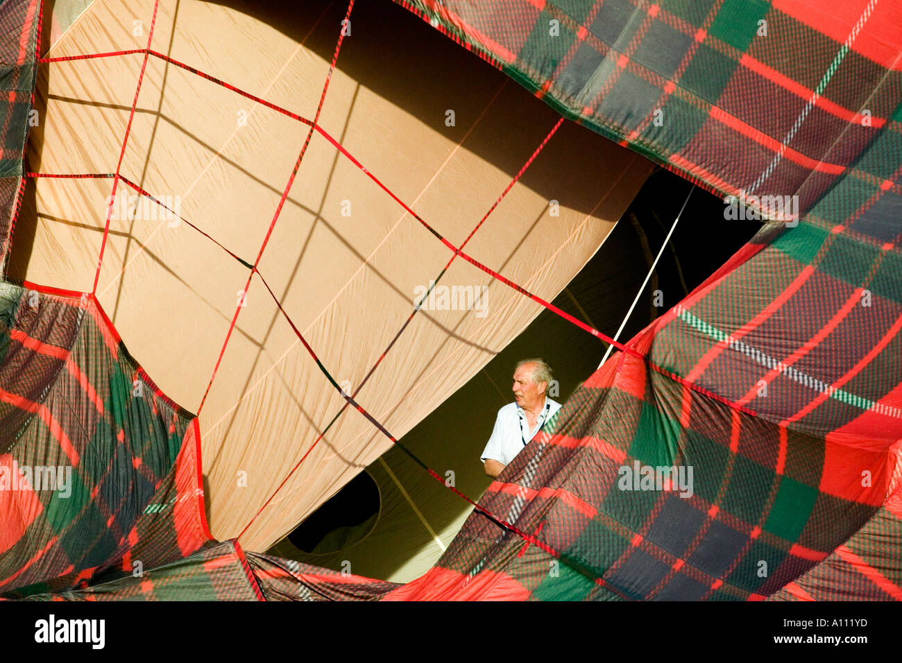 Man inside the envelope of a hot air balloon, Bristol International ...