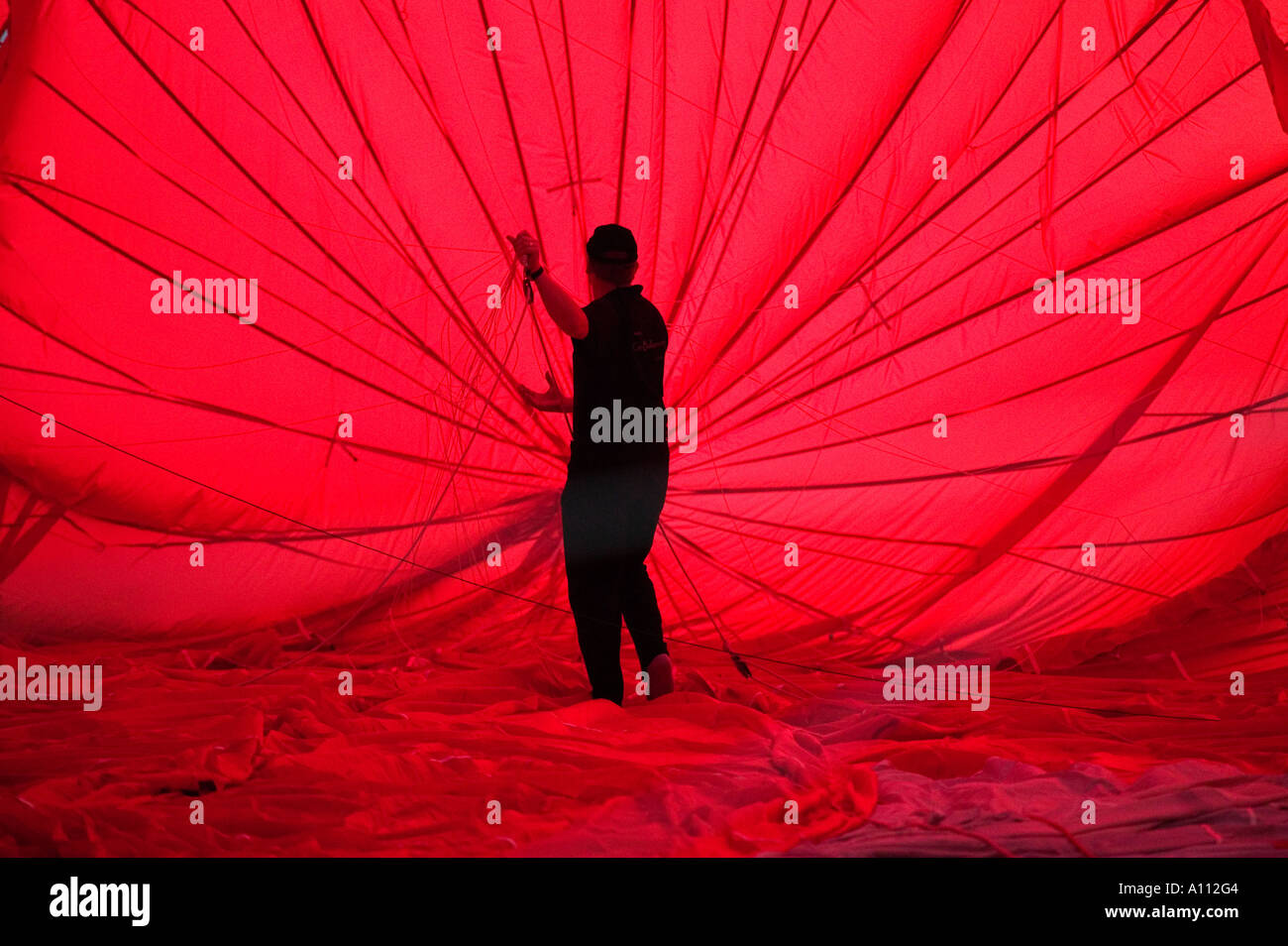 Man inside the envelope of a hot air balloon, Bristol International ...