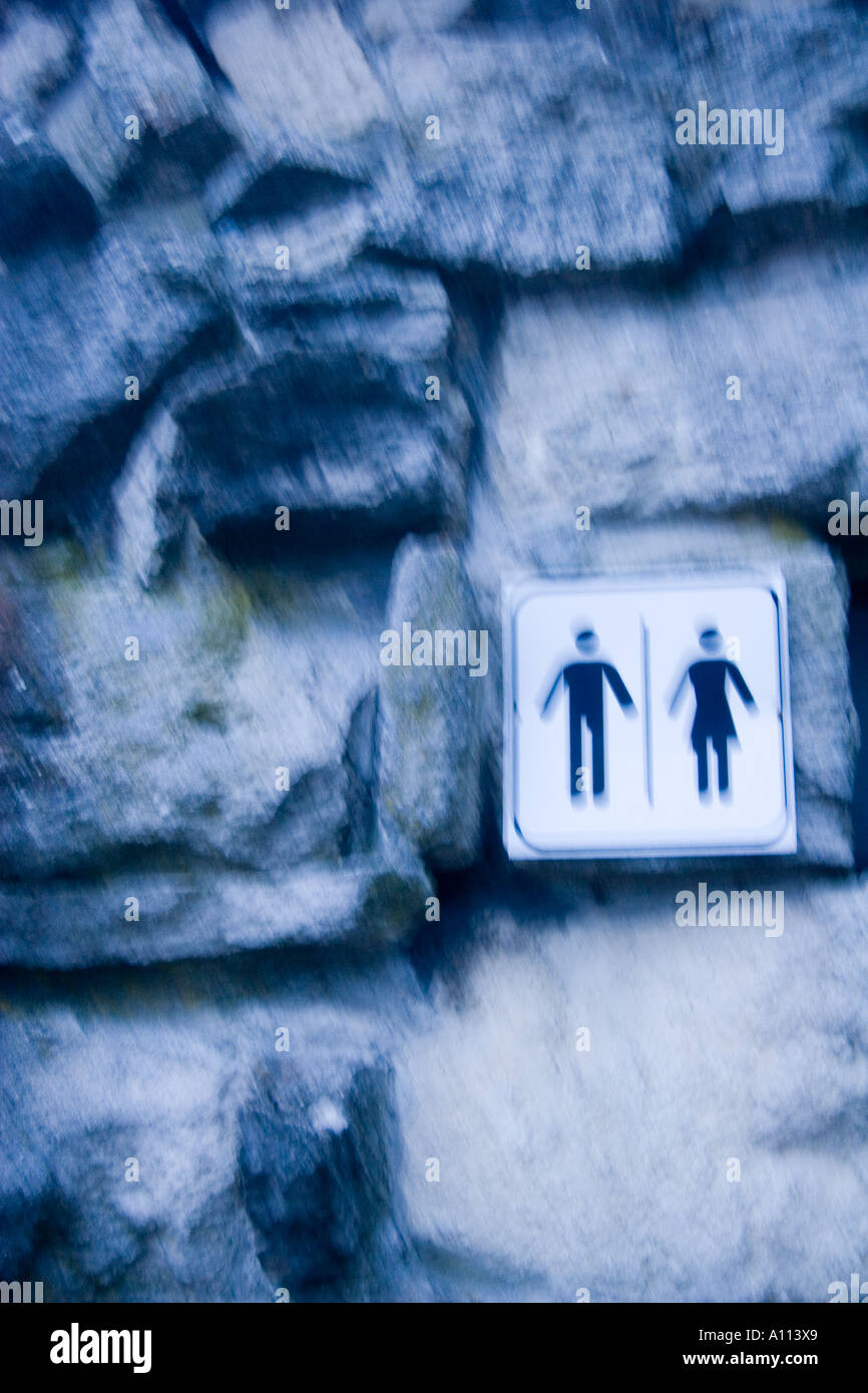toilette bath woman man blue confused Stock Photo - Alamy