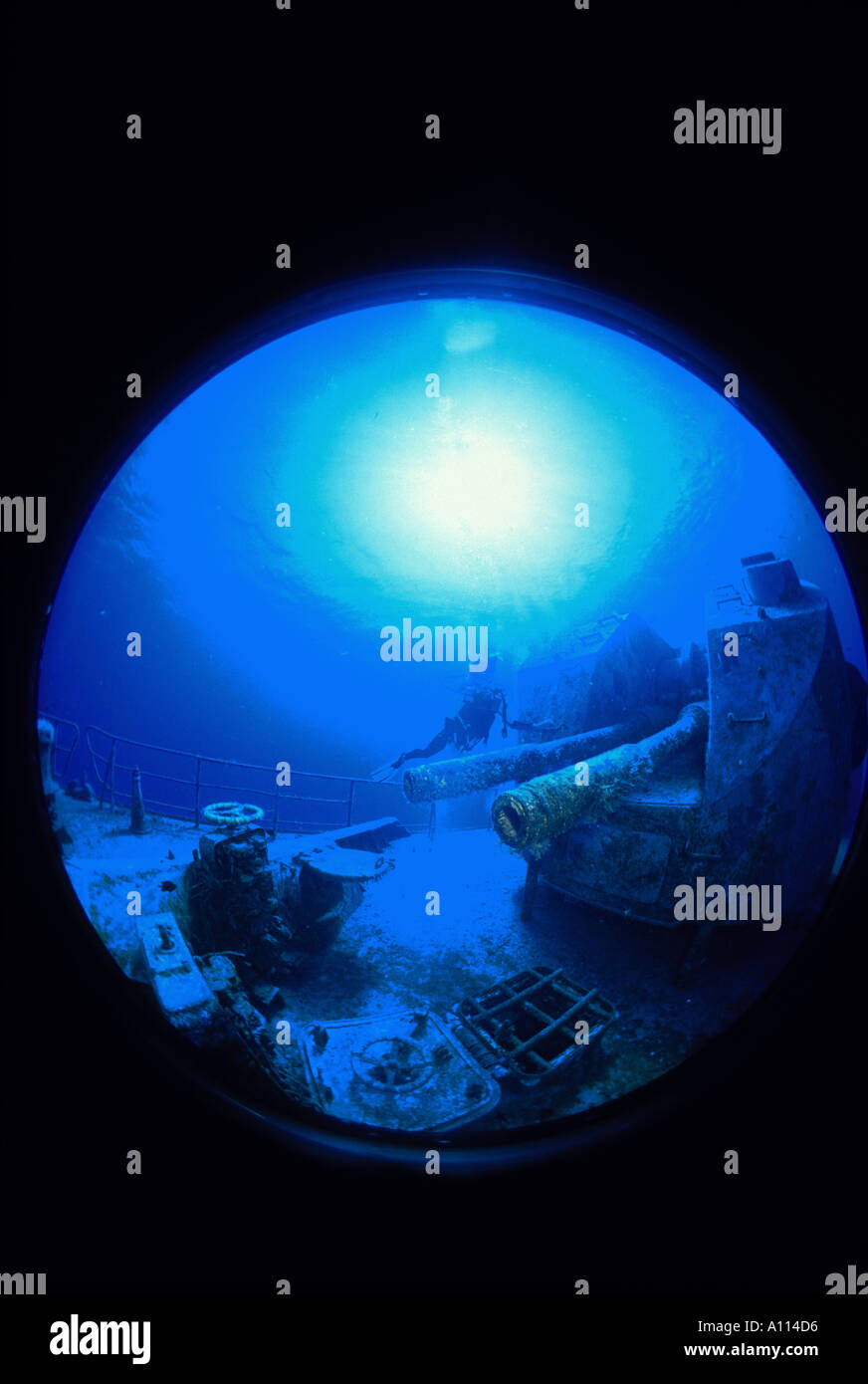 A FEMALE SCUBA DIVER AND THE GUN TURRETS OF THE RUSSIAN DESTROYER 356 ...