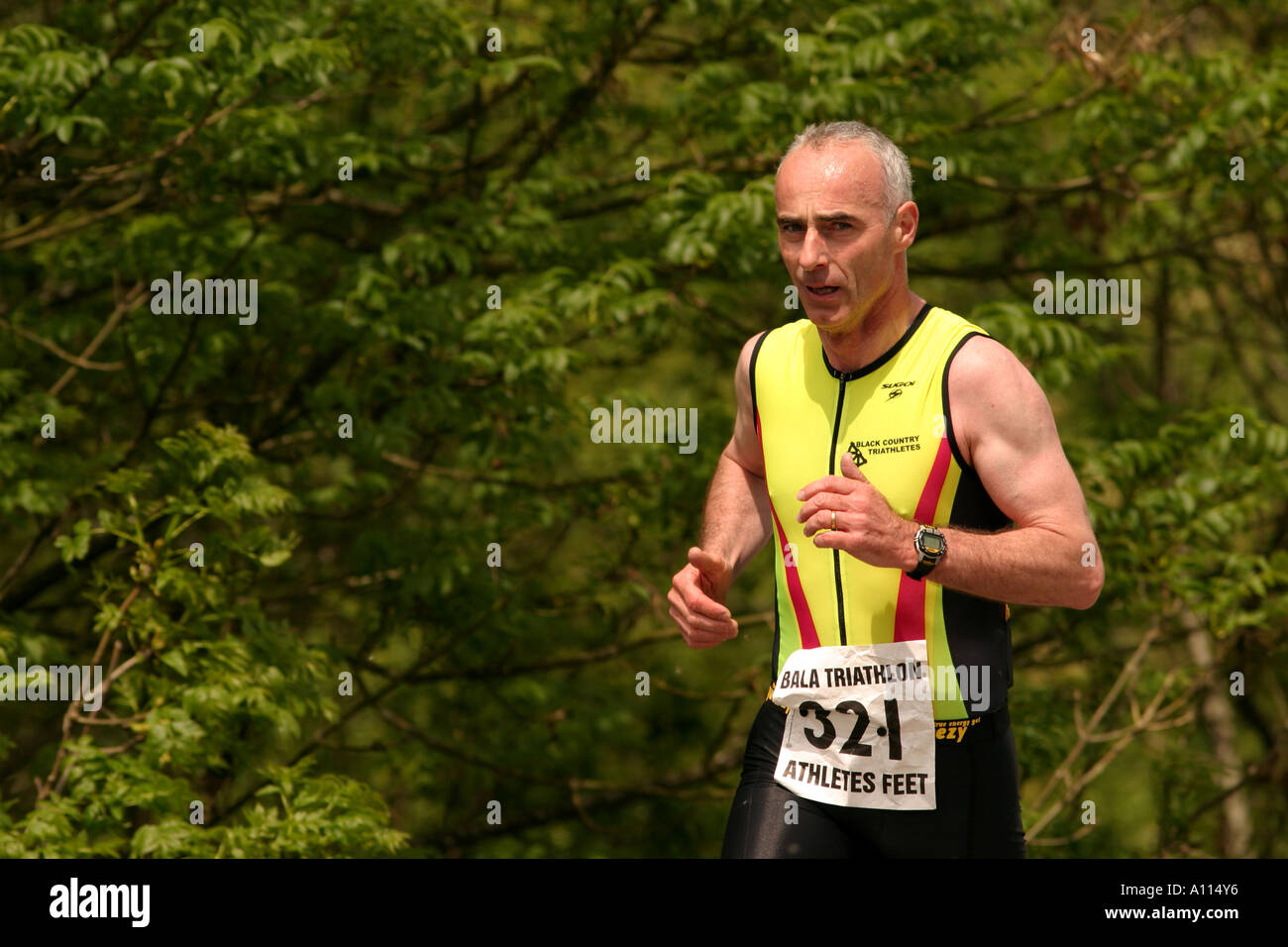 Triathlete running at Bala Middle Distance Triathlon Stock Photo - Alamy