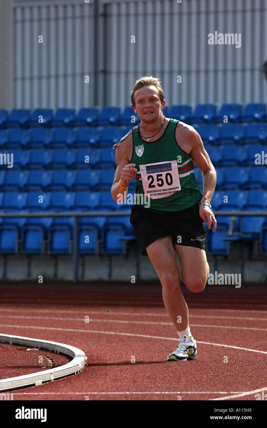 Man male running at athletics track Stock Photo - Alamy