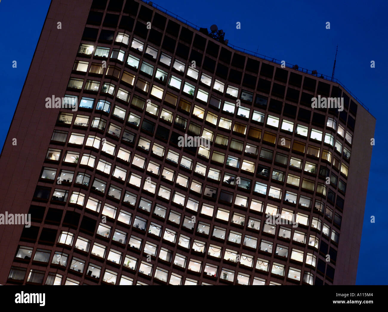 Office tower block at night with illuminated windows Stock Photo - Alamy