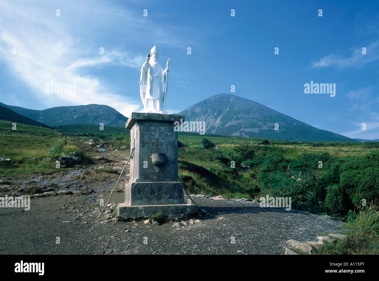A marble statue of St Patrick on a stone plinth on the summit of the ...