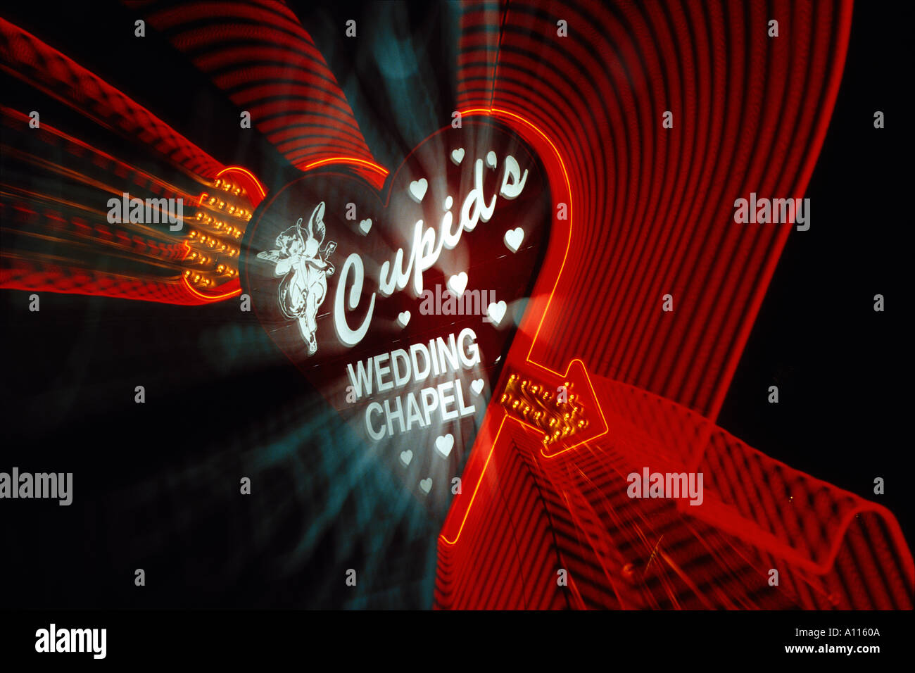 Zoomed view of neon sign at night Cupid s Wedding Chapel Las Vegas ...