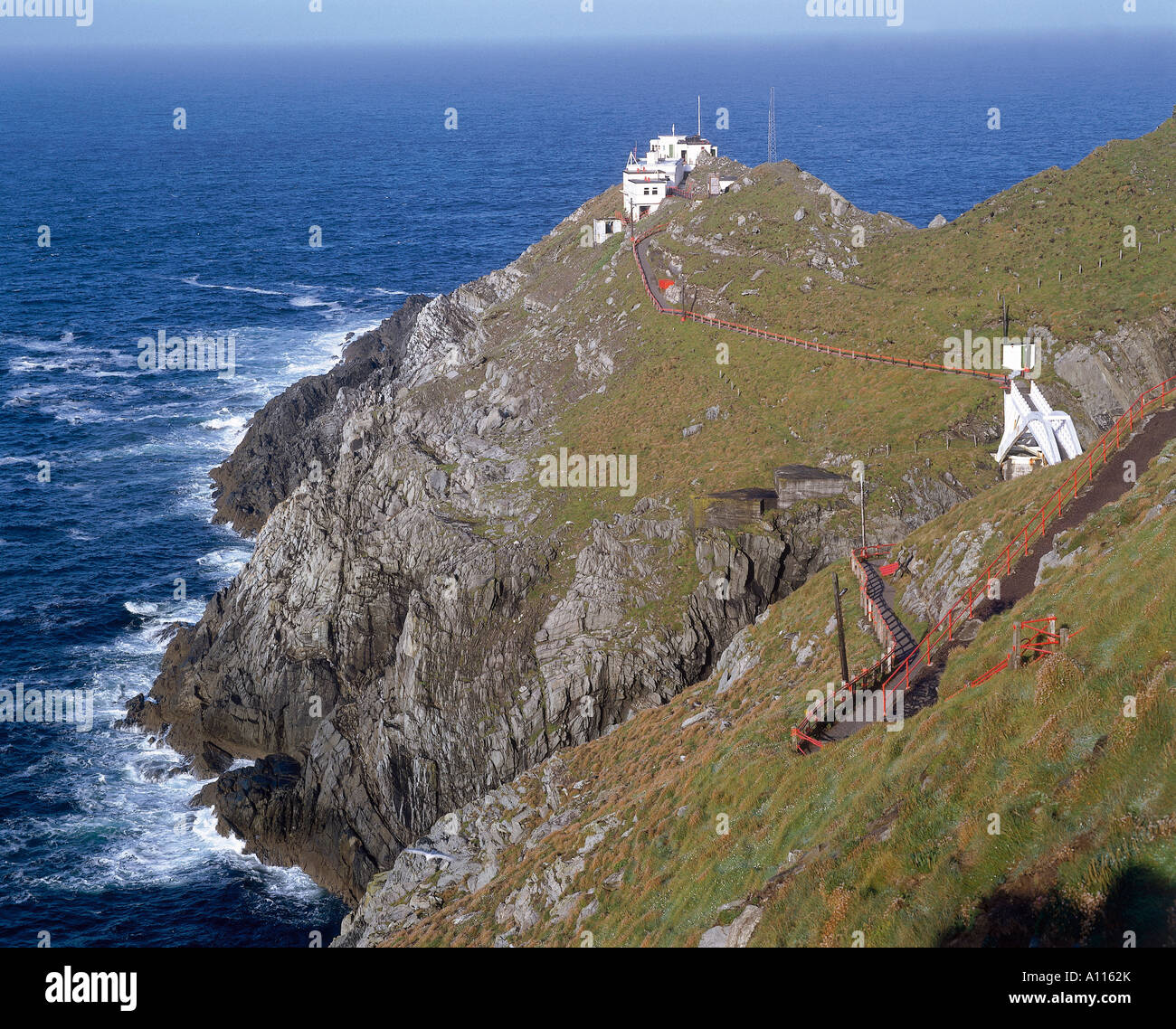 Whitewashed buildings comprise the Mizen Head lighthouse Stock Photo ...