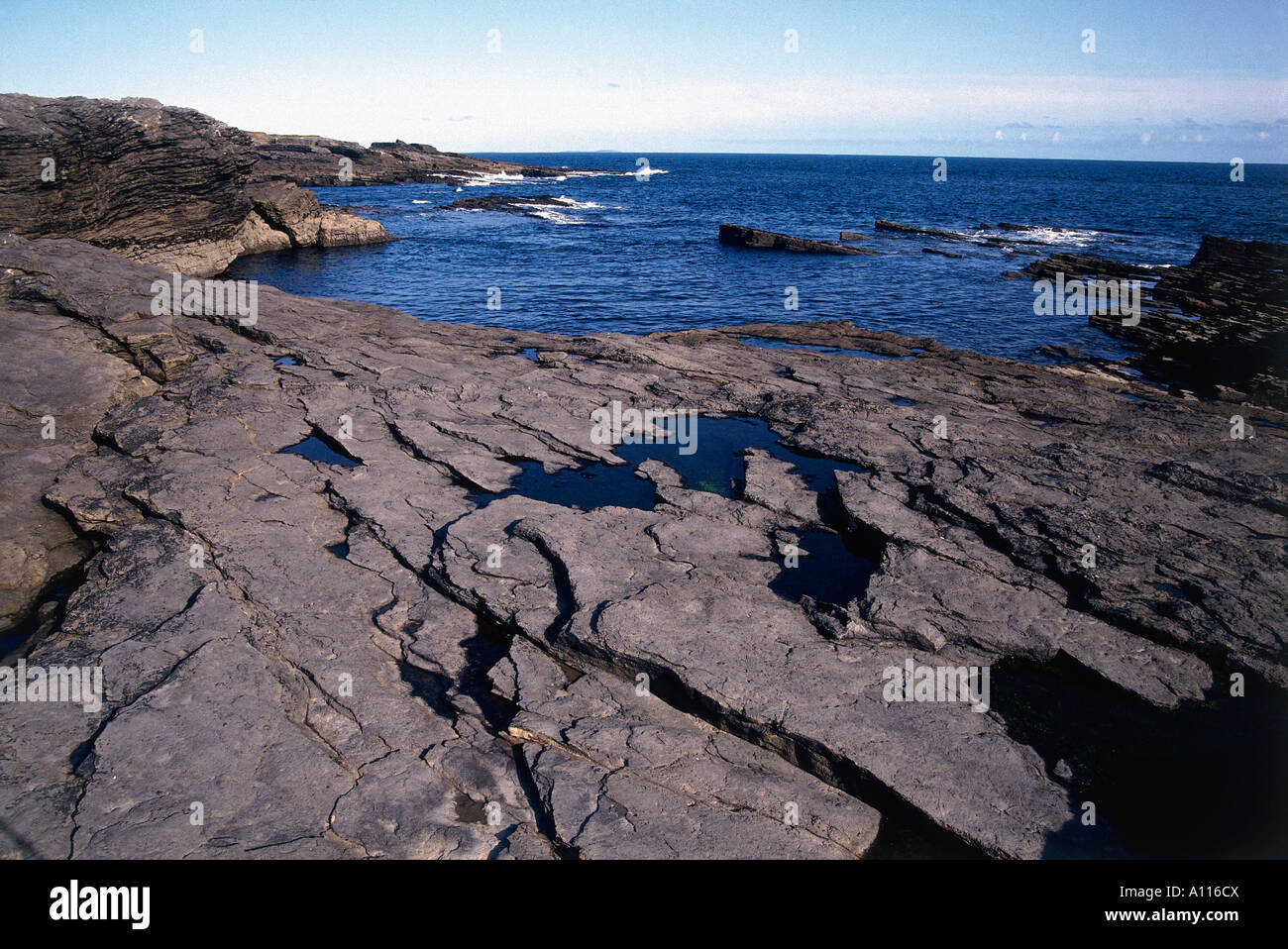Craggy rocks and small cliff faces on the coast at Hook Head Stock ...