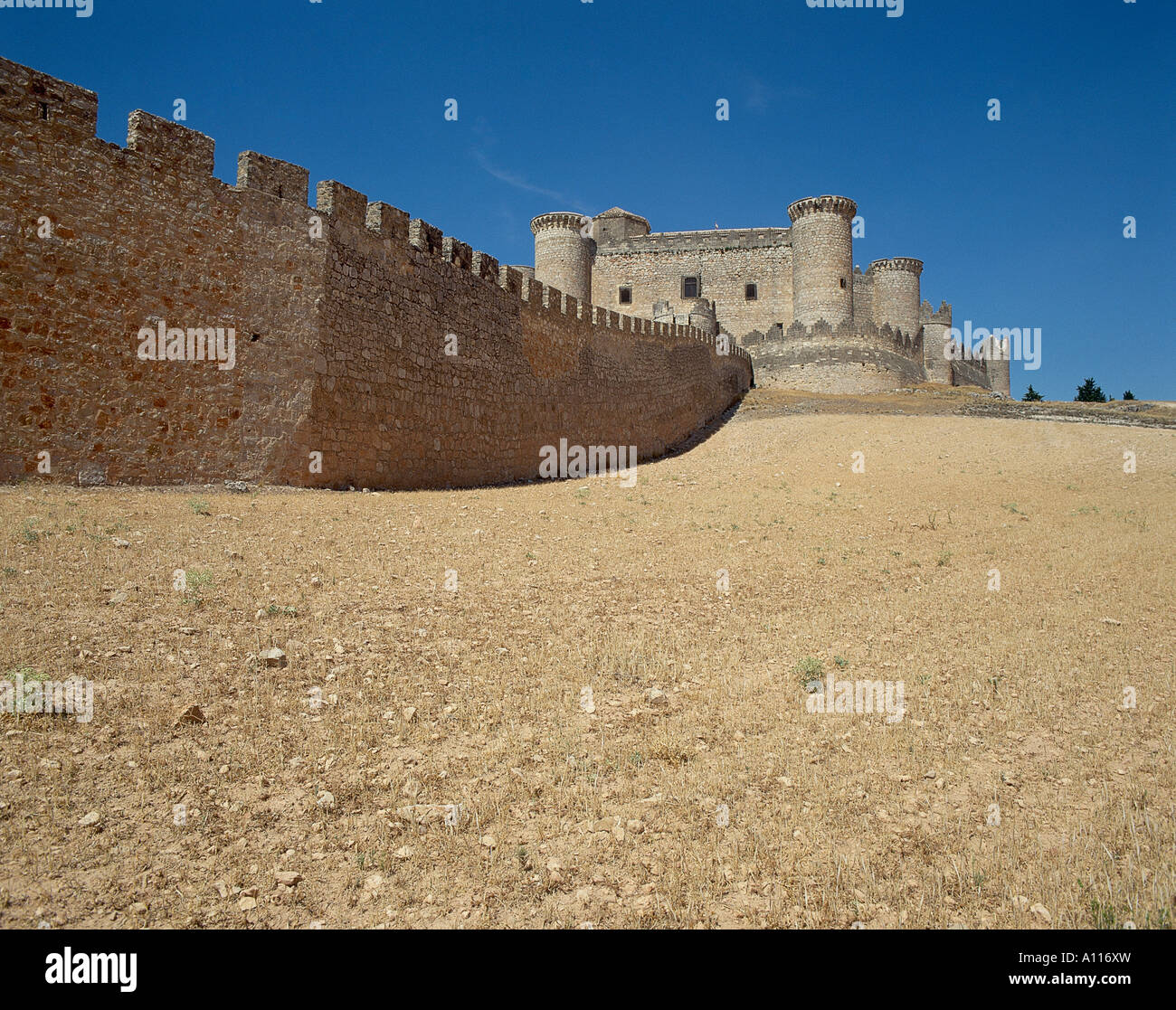 Crenellated walls curving around the exterior of the 15th century ...