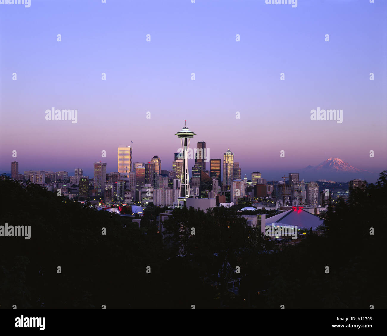 Seattle Washington skyline at sunset with Mount Rainier in distance ...