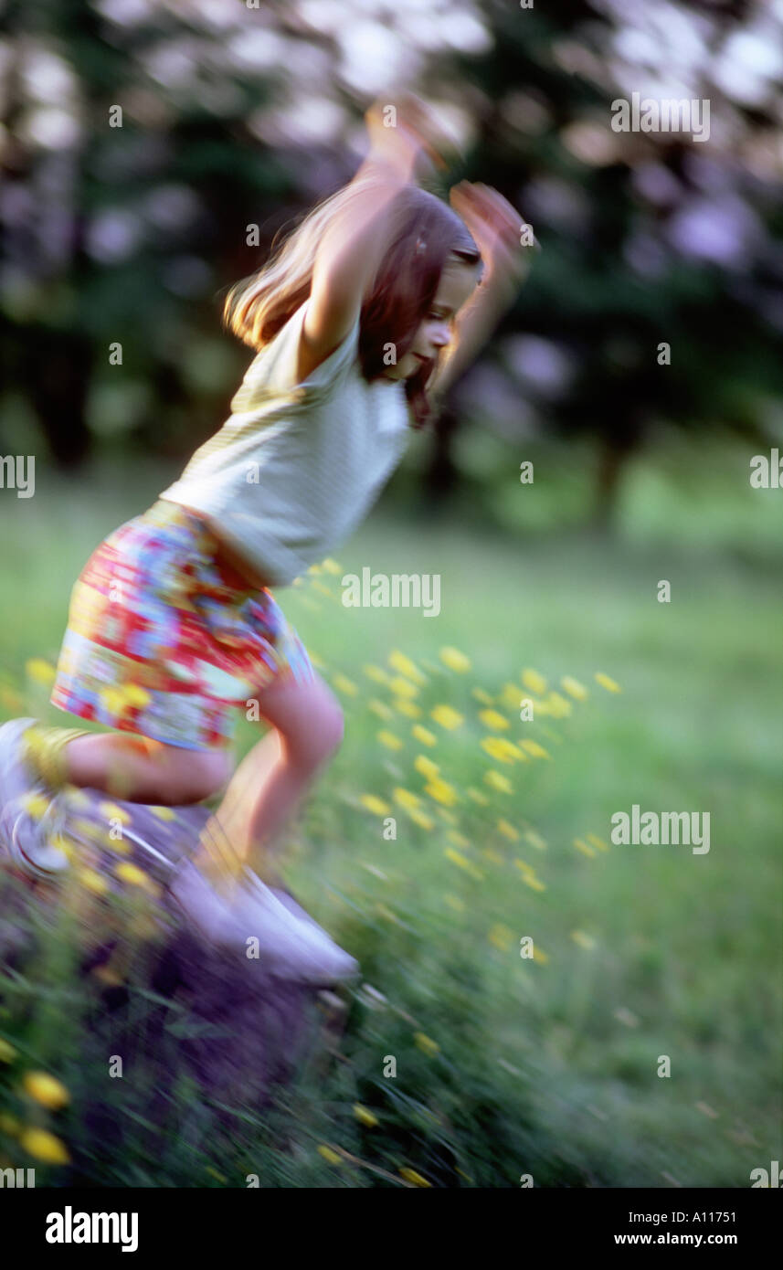 girl jumping over log Stock Photo - Alamy