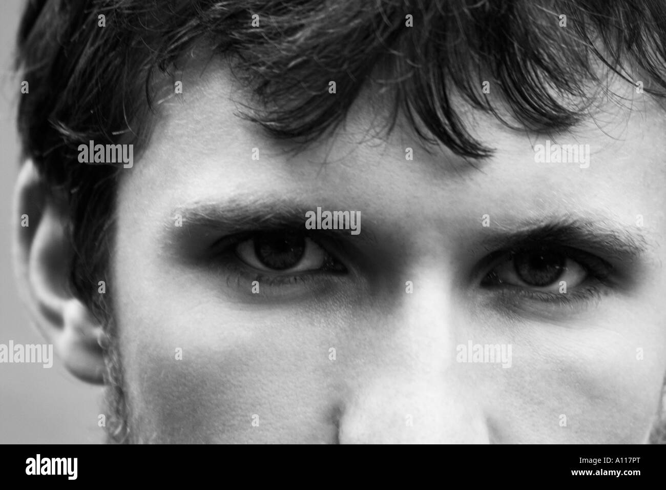 a portrait of a young serious man Stock Photo - Alamy