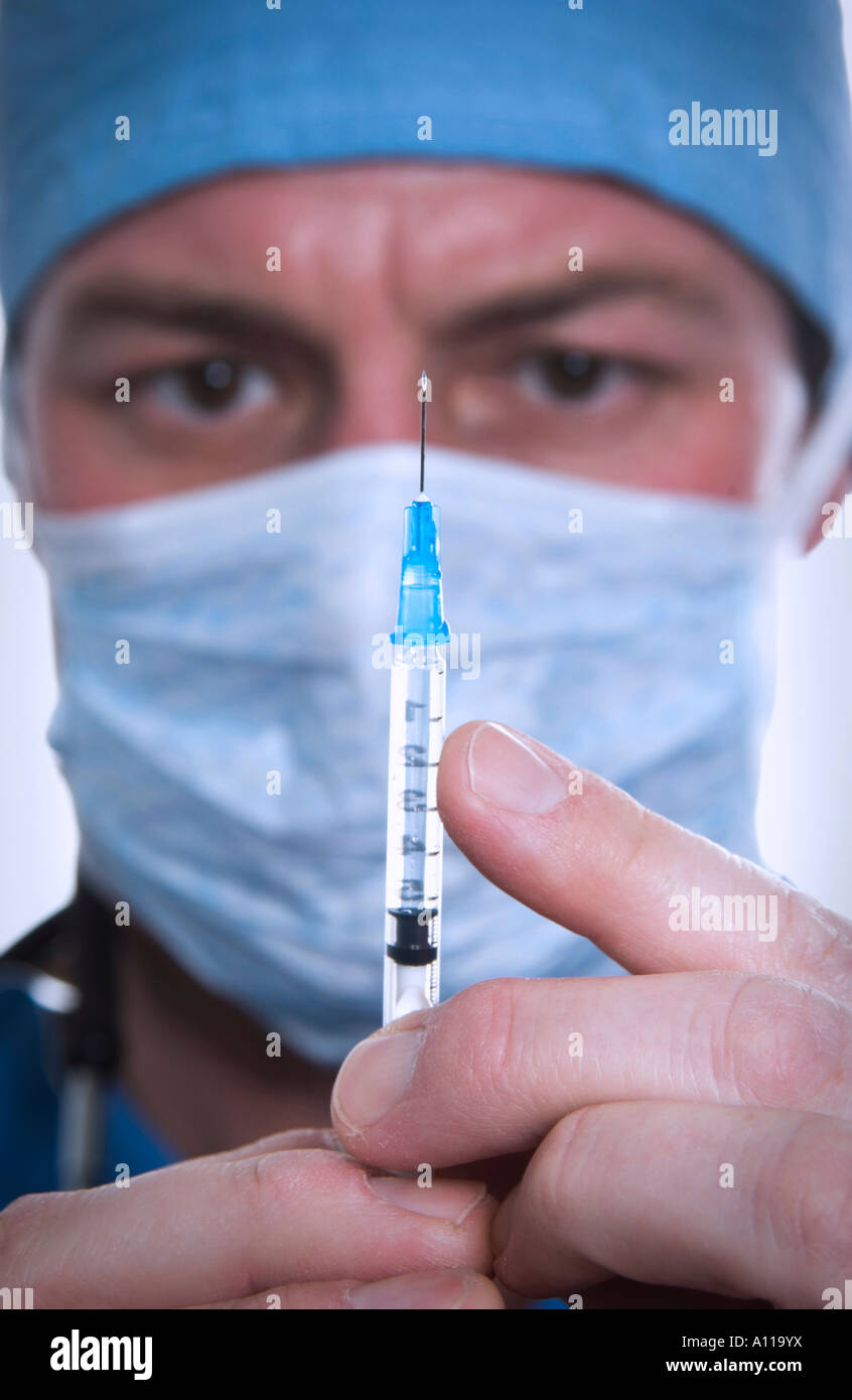 Male doctor filling syringe Stock Photo - Alamy