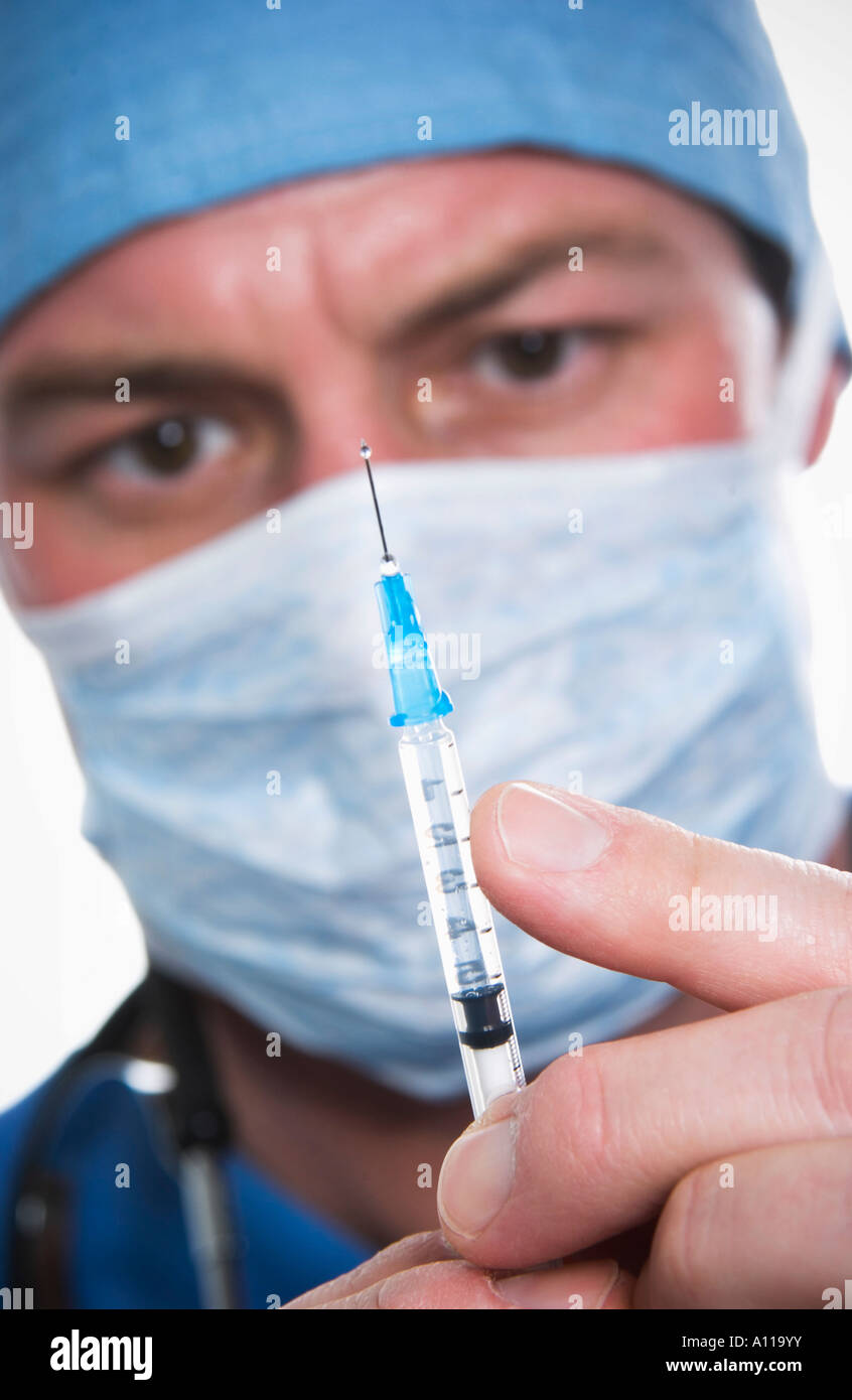 Male doctor filling syringe Stock Photo - Alamy