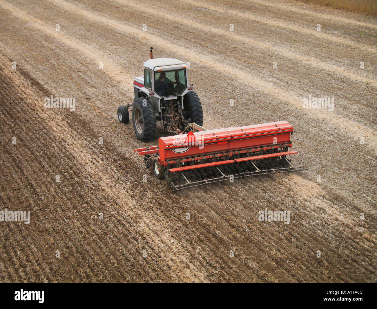 Farmer plowing field Stock Photo - Alamy