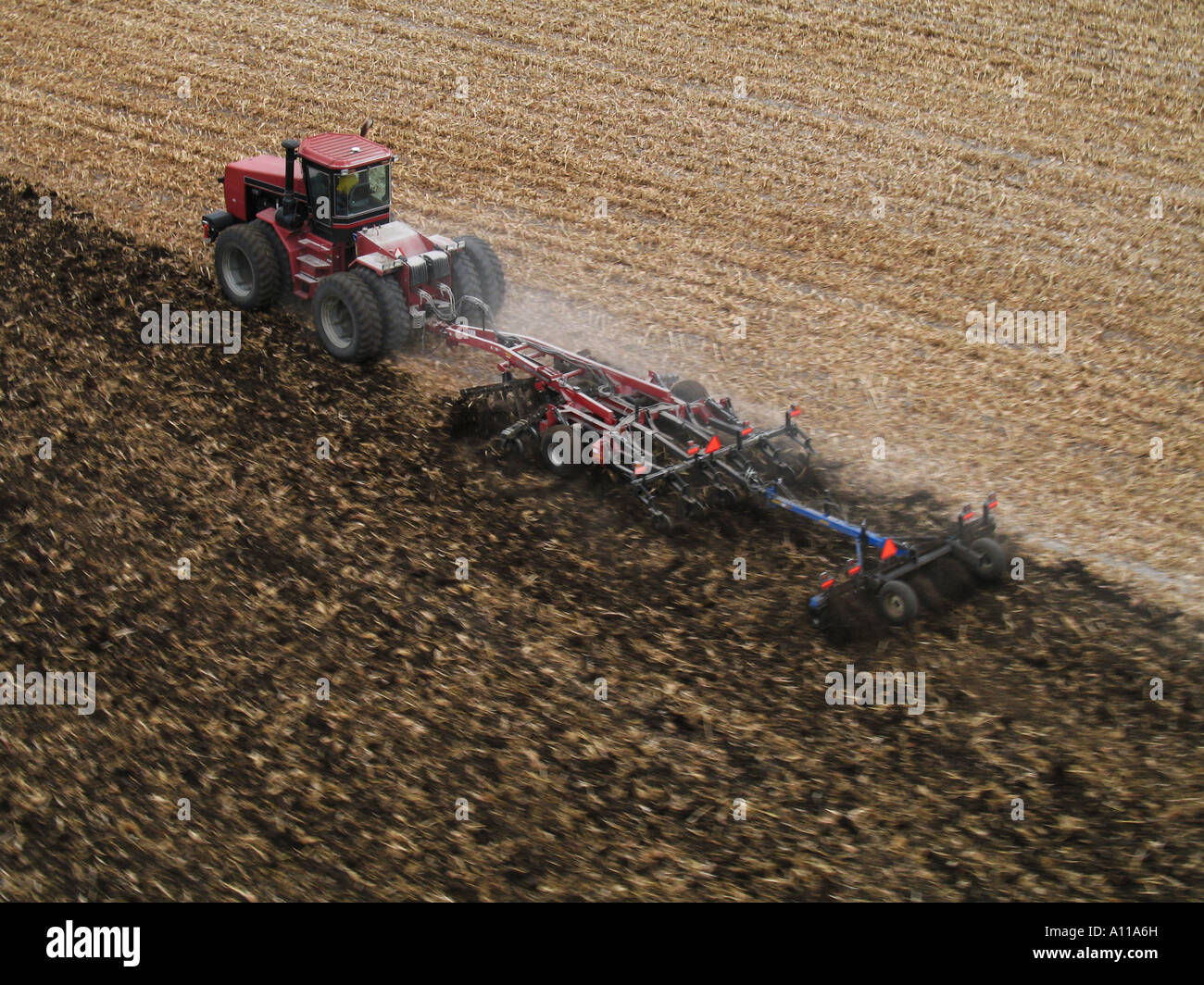 Farmer plowing field Stock Photo - Alamy