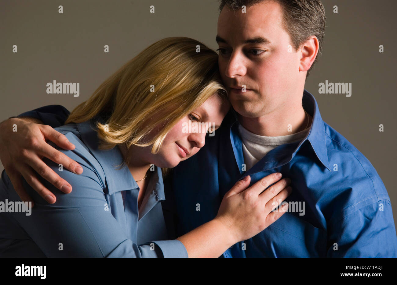 Man consoling woman Stock Photo - Alamy