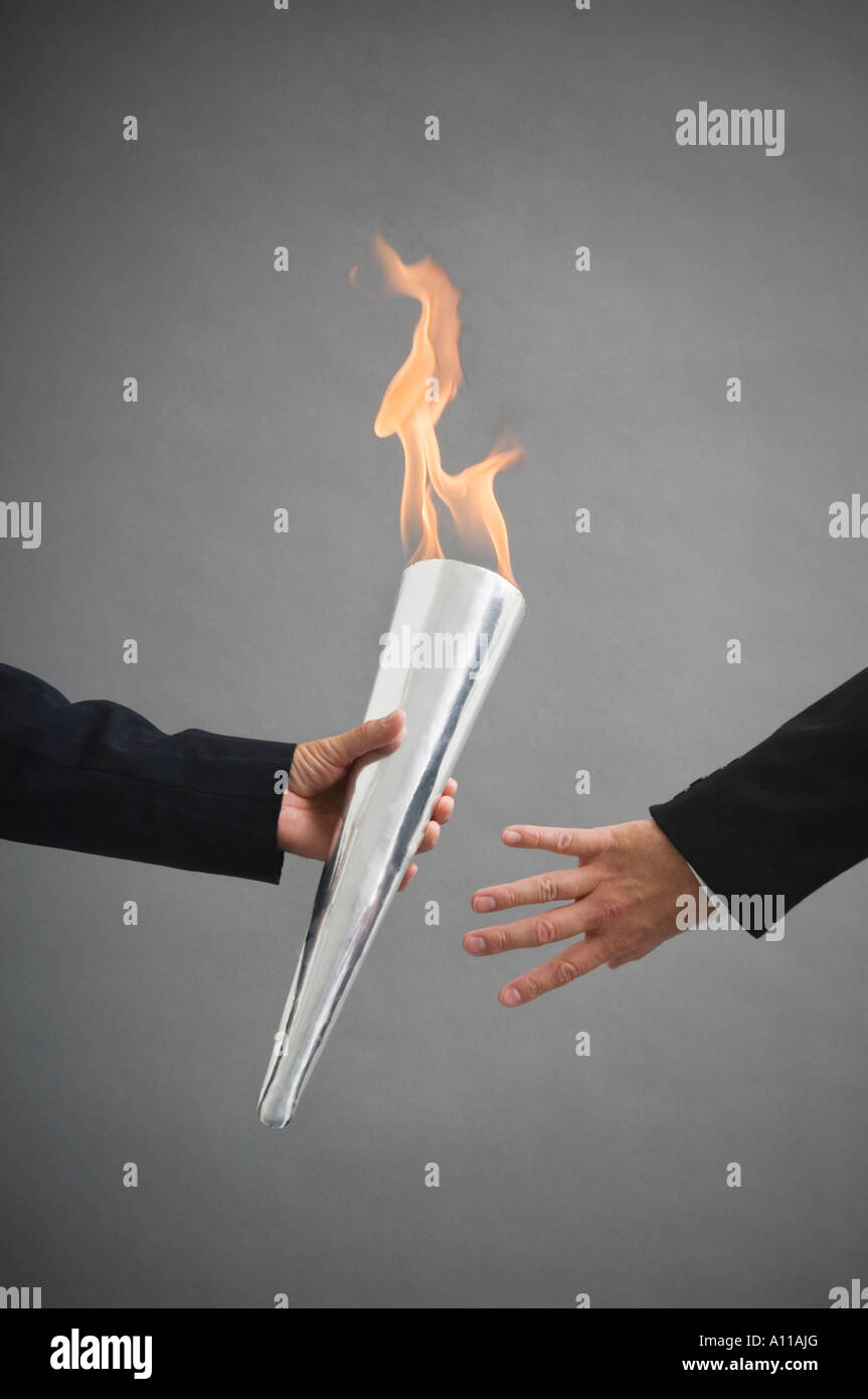 Man passing the torch Stock Photo - Alamy