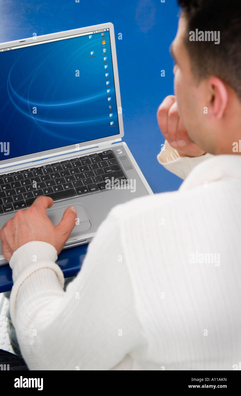 Man working on laptop Stock Photo - Alamy