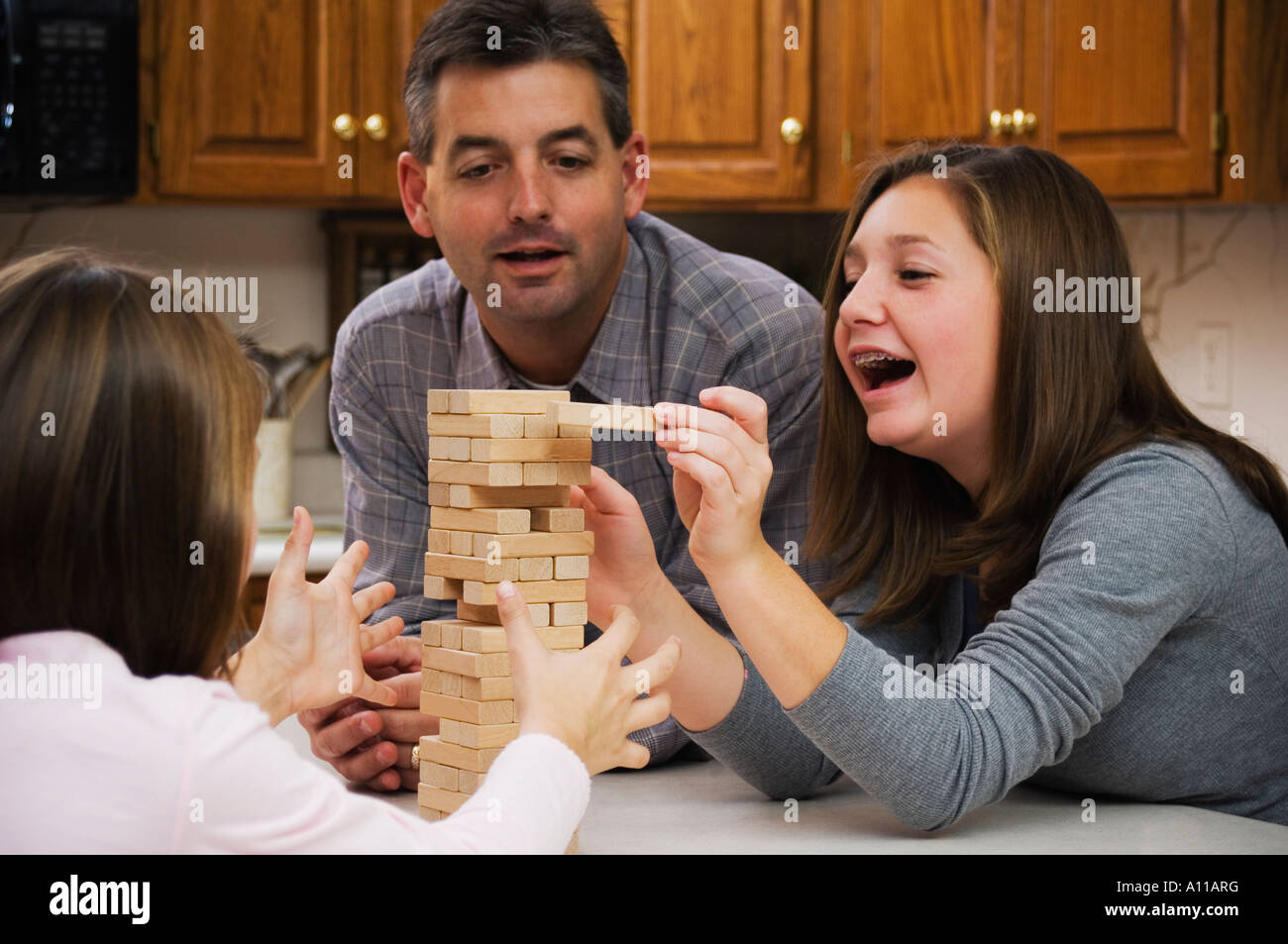 Family playing a game Stock Photo - Alamy