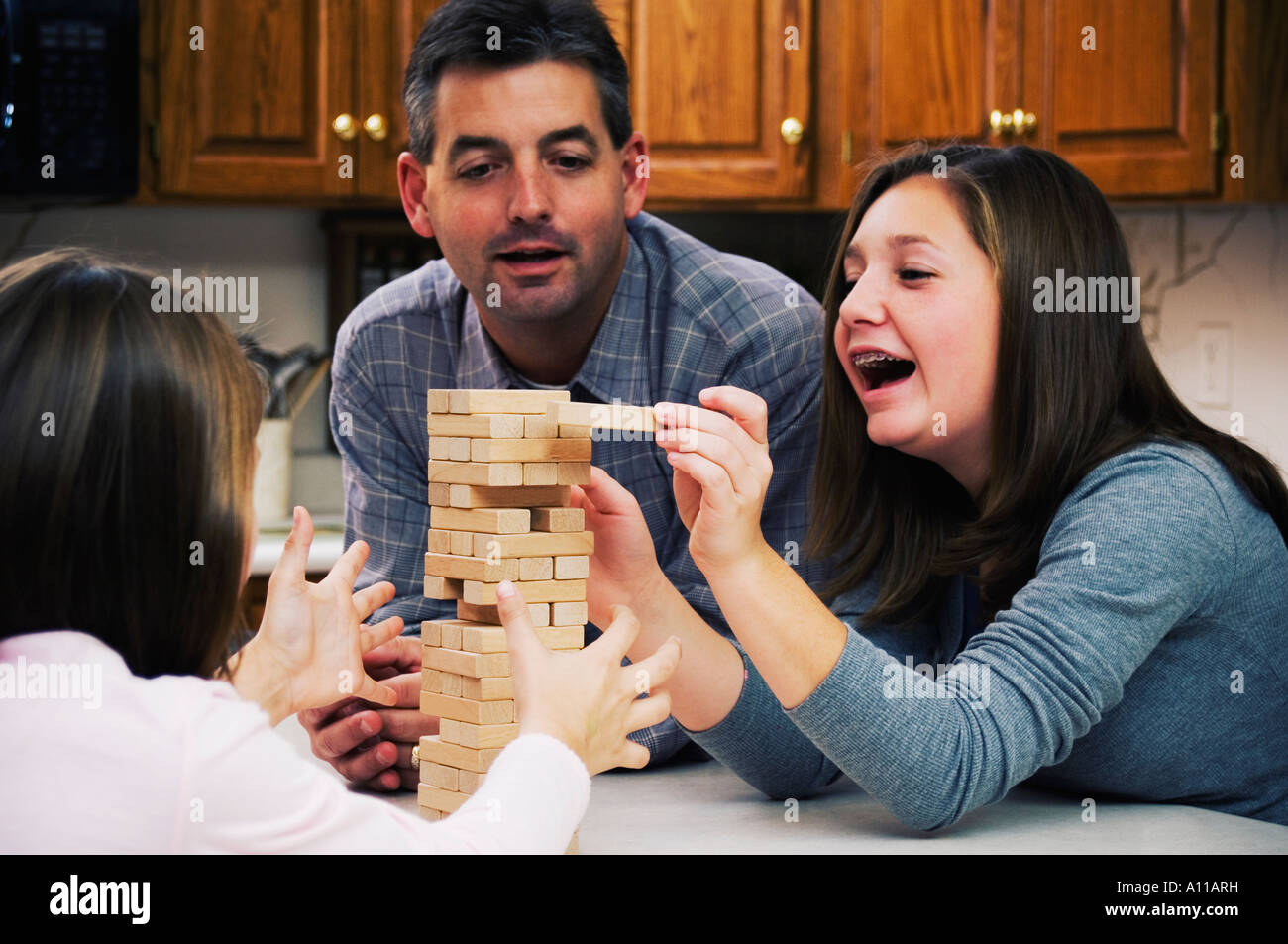 Family playing a game Stock Photo - Alamy