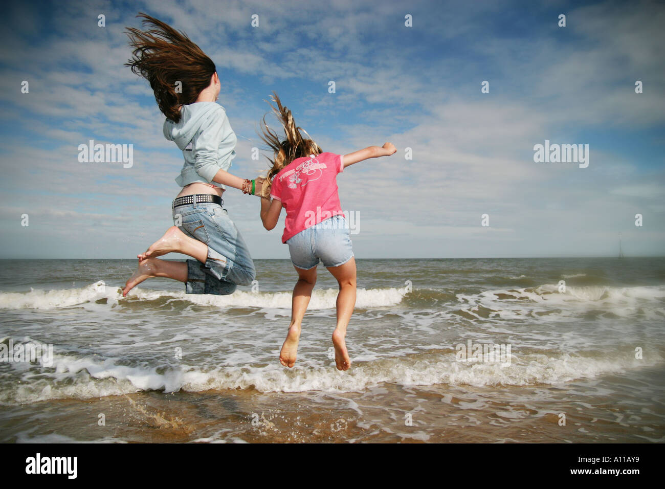 Girls leap hi-res stock photography and images - Alamy