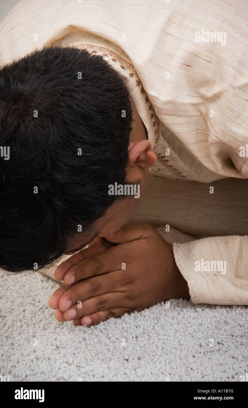 Middle Eastern man praying Stock Photo - Alamy