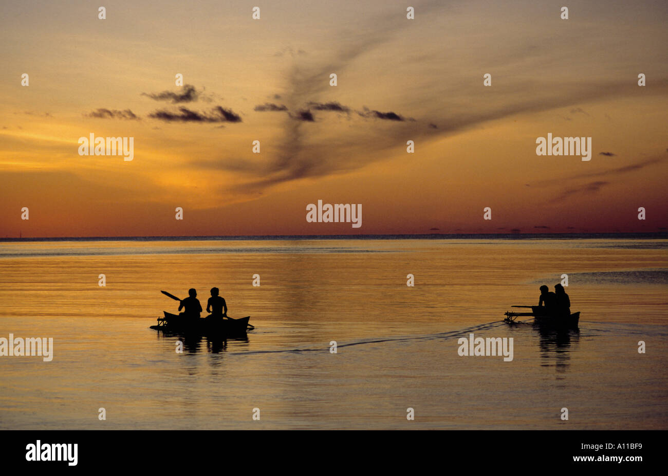Outrigger canoes at sunset Tarawa Kiribati Central Pacific Stock Photo ...