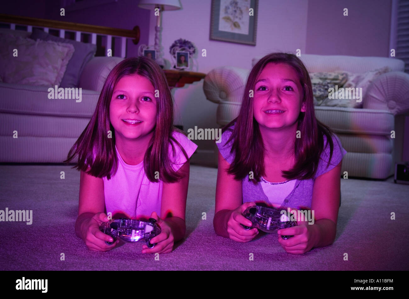 Girls playing video games Stock Photo - Alamy