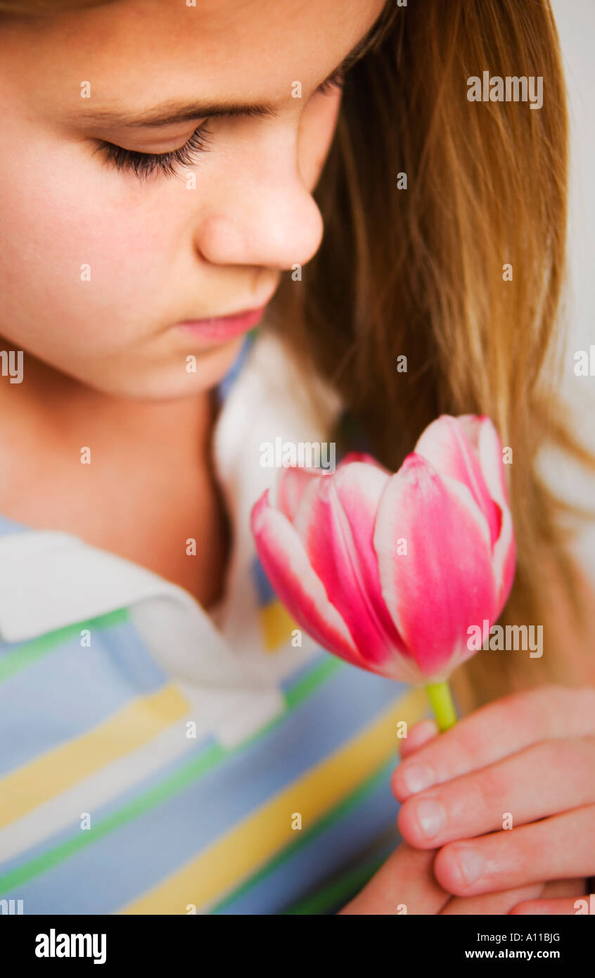 Girl holding tulip Stock Photo - Alamy