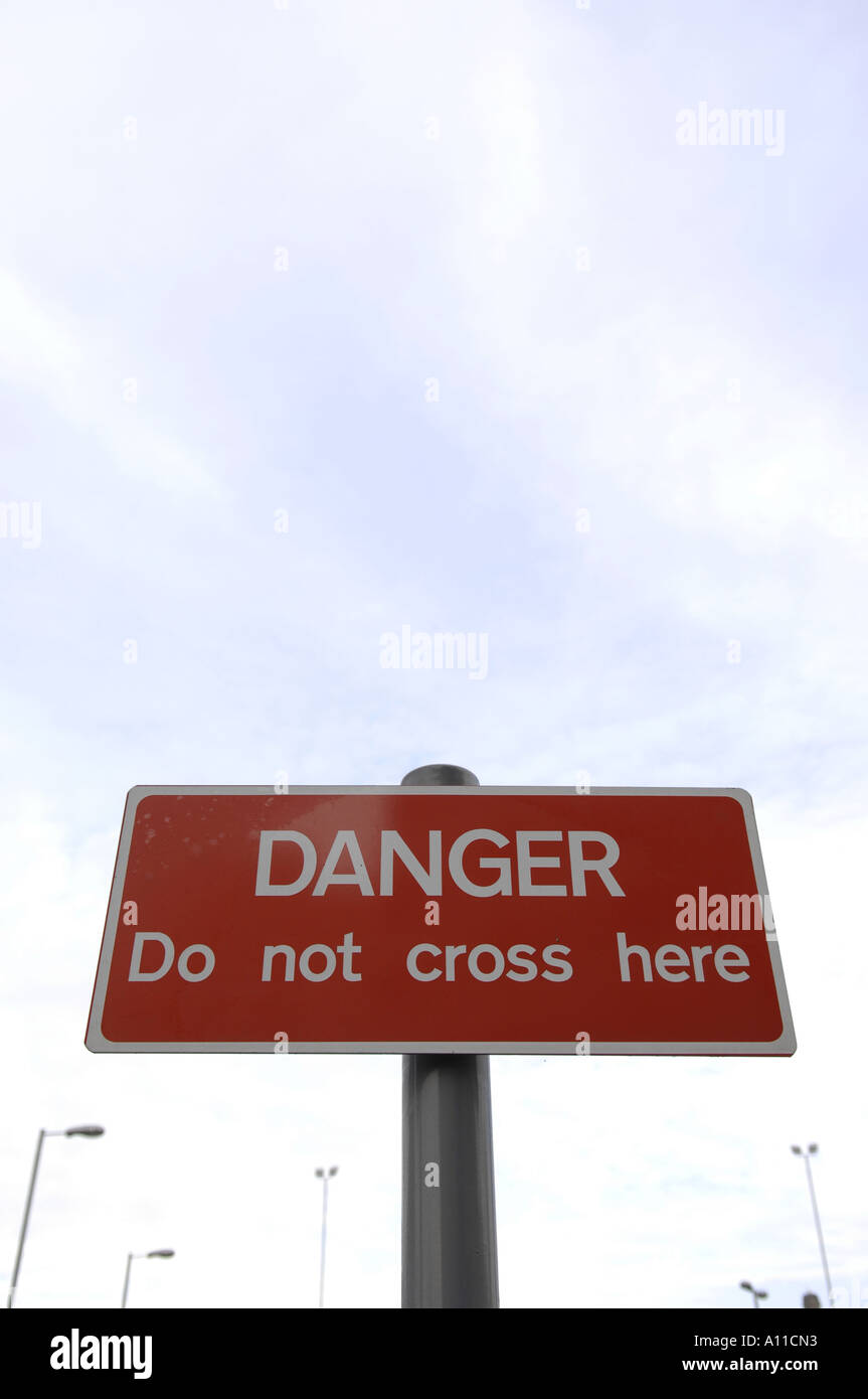 danger do not cross here red sign safety precaution vertical sky colour ...