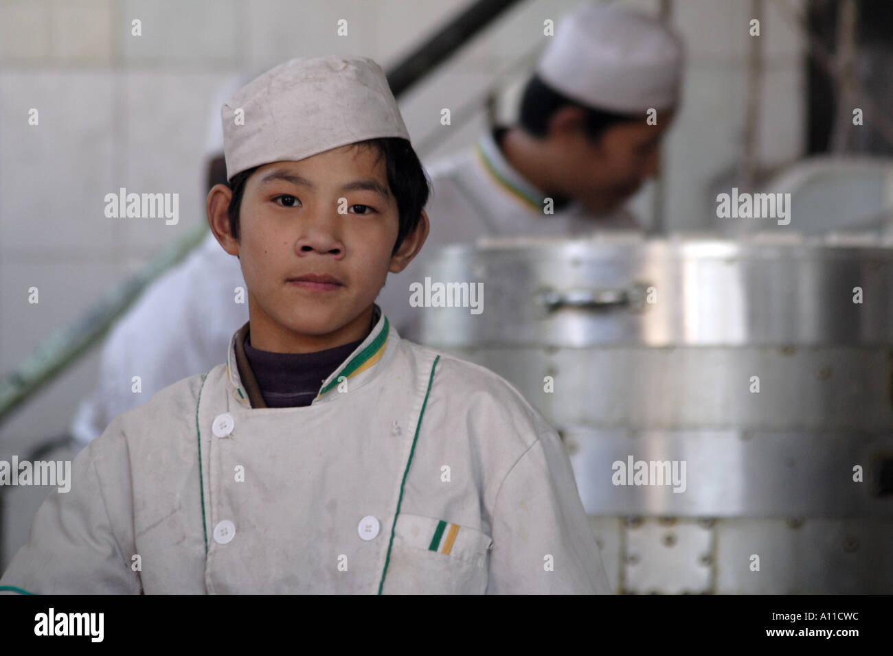 Boy working in a bakery in the Hutong, Beijing, China Stock Photo - Alamy