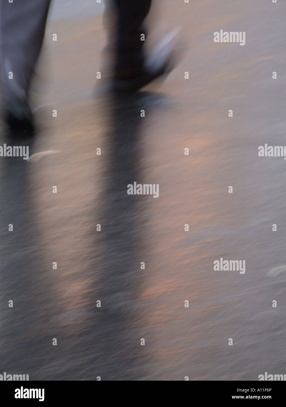 person walking in rain in town Stock Photo - Alamy