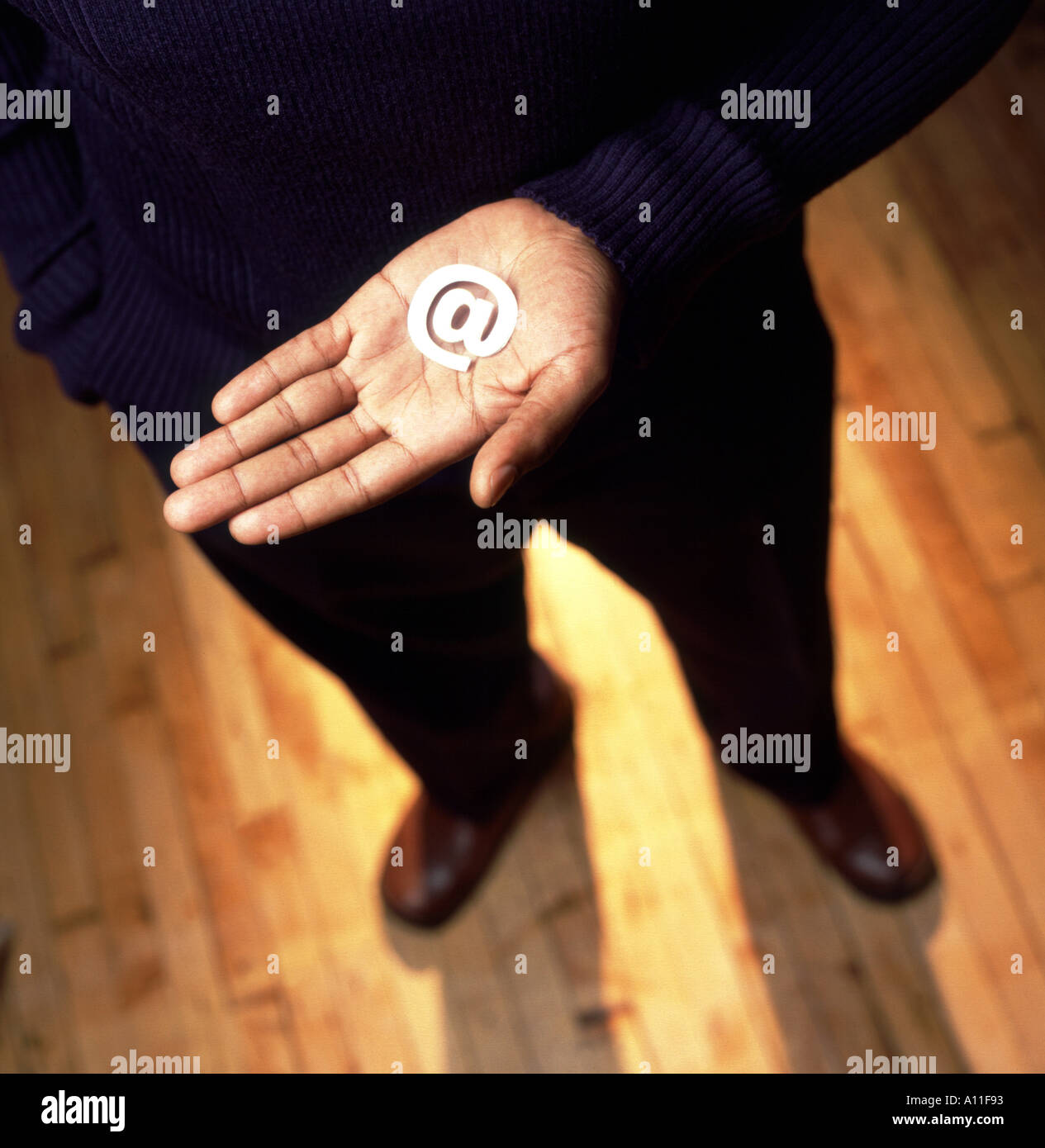 Man holding symbol Stock Photo - Alamy