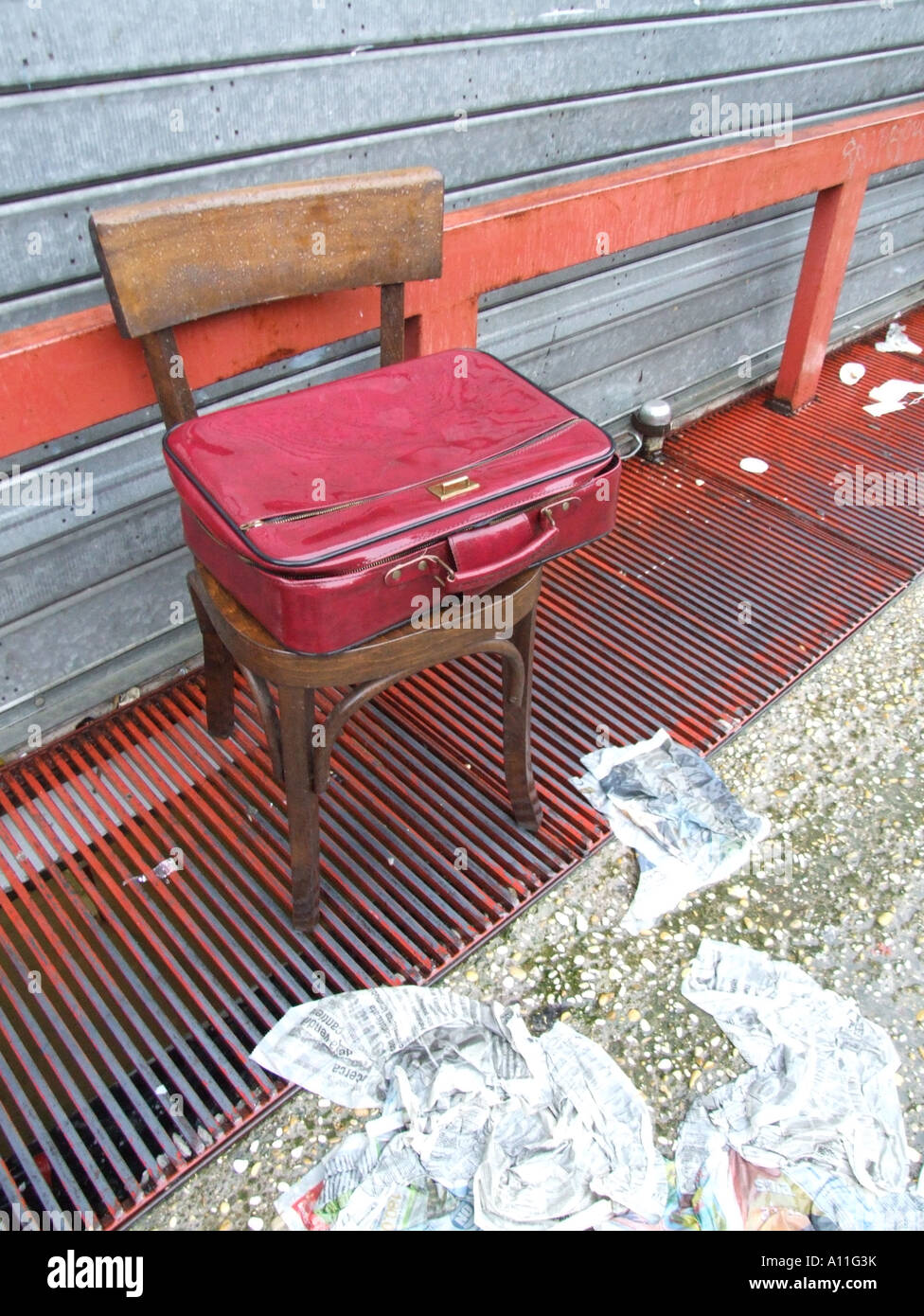 suitcase on chair in street Stock Photo - Alamy