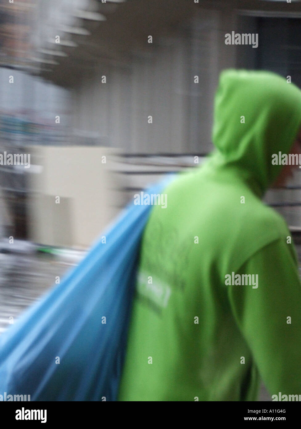 person carrying sack in street Stock Photo - Alamy