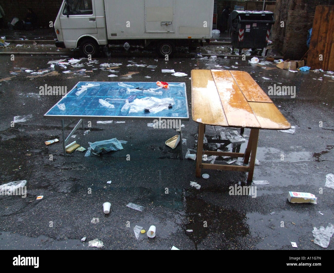litter on rain soaked empty market stall in town Stock Photo - Alamy