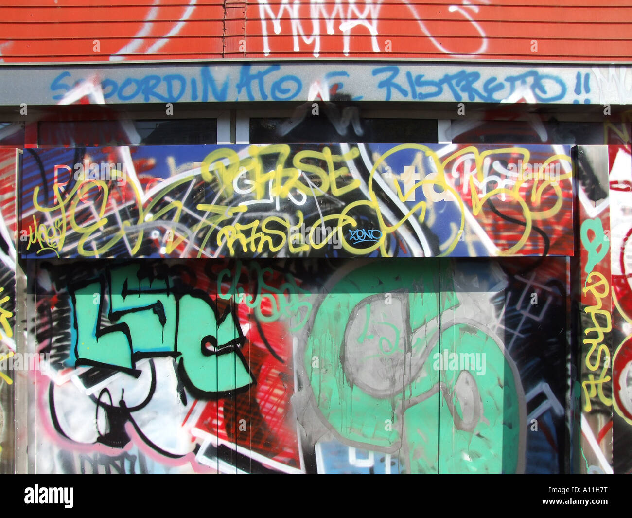 name plate board covered with graffiti in train station in rome Stock ...