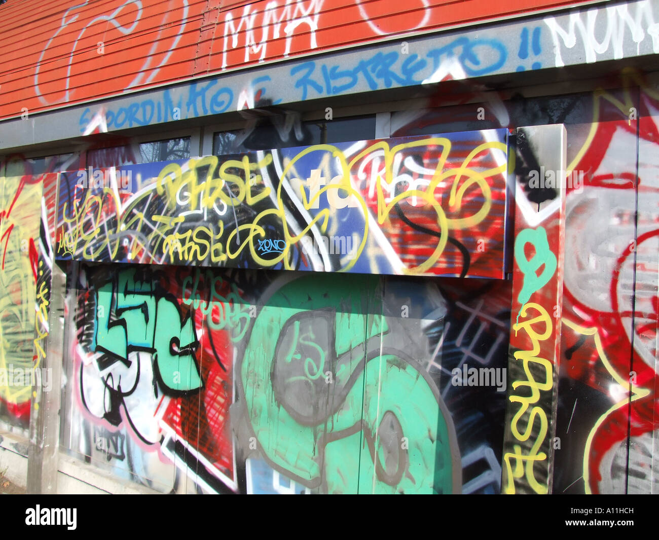 name plate board covered with graffiti in train station in rome Stock ...